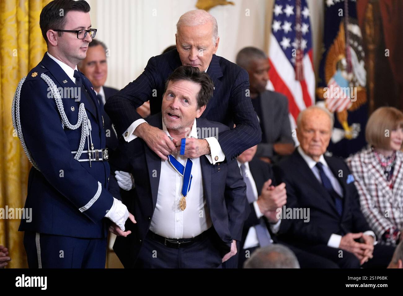 President Joe Biden, right, presents the Presidential Medal of Freedom ...