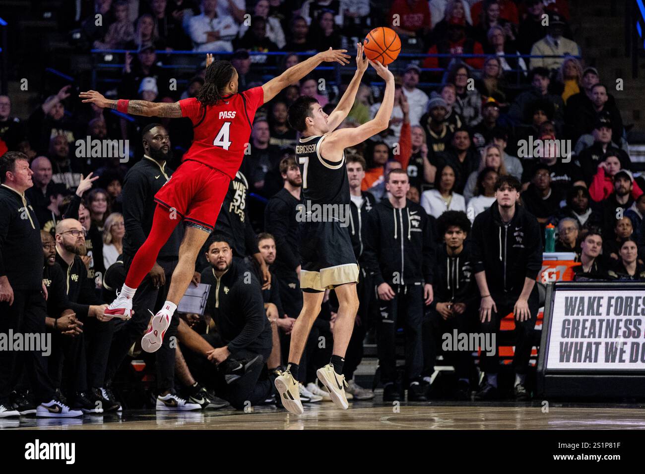 Winston-Salem, NC, USA. 4th Jan, 2025. Wake Forest guard Parker Friedrichsen (7) shoots under ...