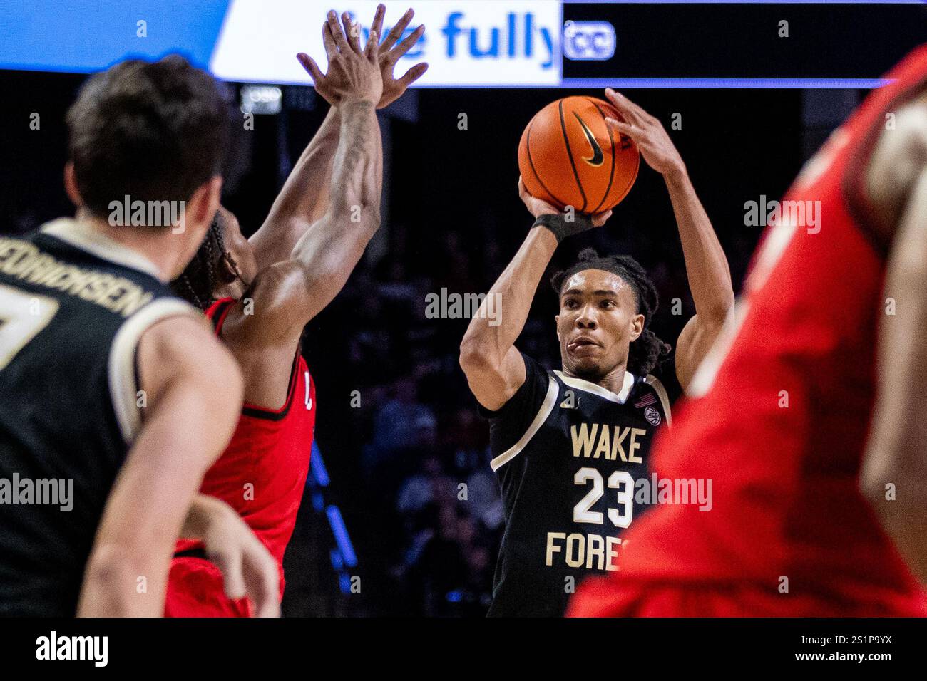Winston-Salem, NC, USA. 4th Jan, 2025. Wake Forest guard Hunter Sallis (23) shoots against the ...