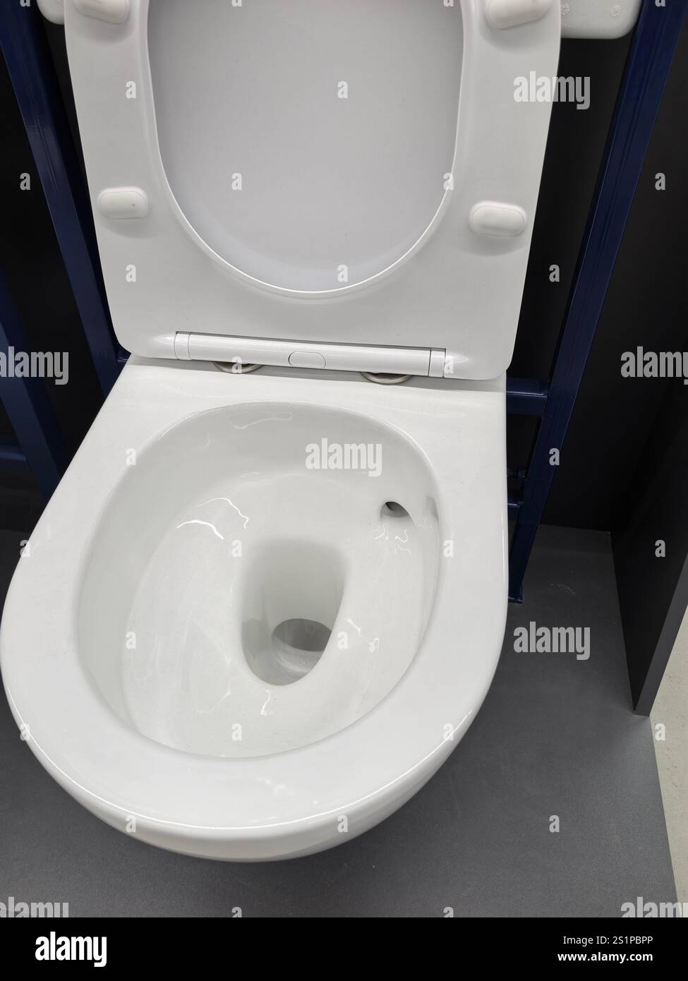 A sleek and modern toilet is showcased in a restroom, featuring a clean ...