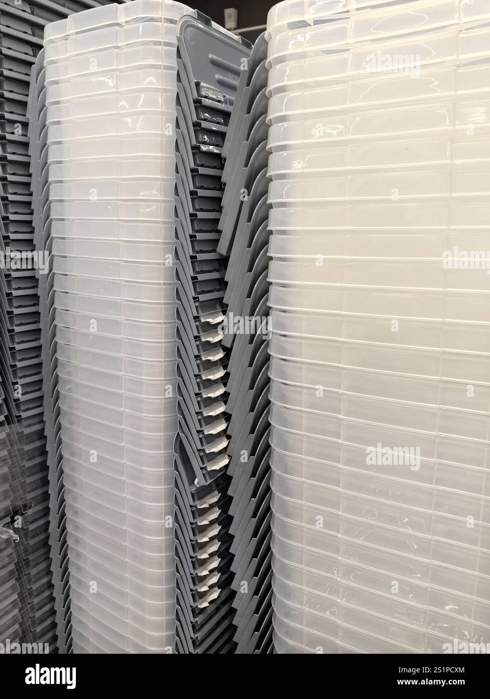 A vast assembly of clear plastic storage containers fills the frame ...