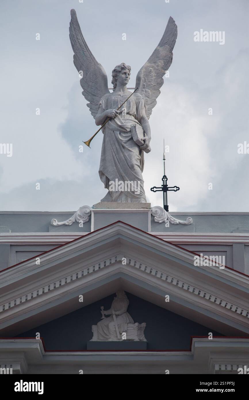 The Angel with a trumpet statue at the facade of the Cathedral Basilica ...
