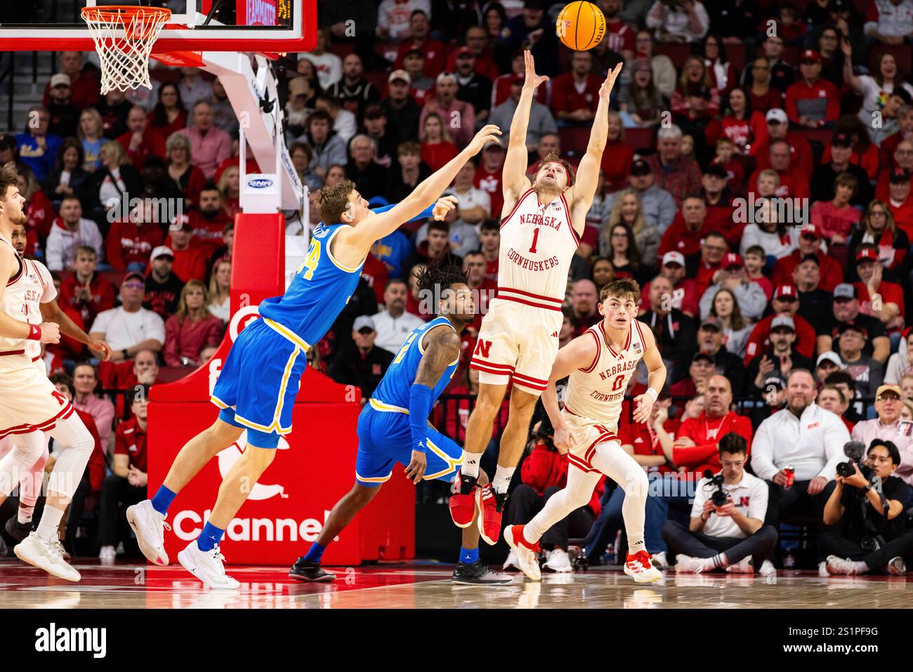 Nebraska guard Sam Hoiberg (1) reaches for a rebound ahead of UCLA forward Tyler Bilodeau (34 ...