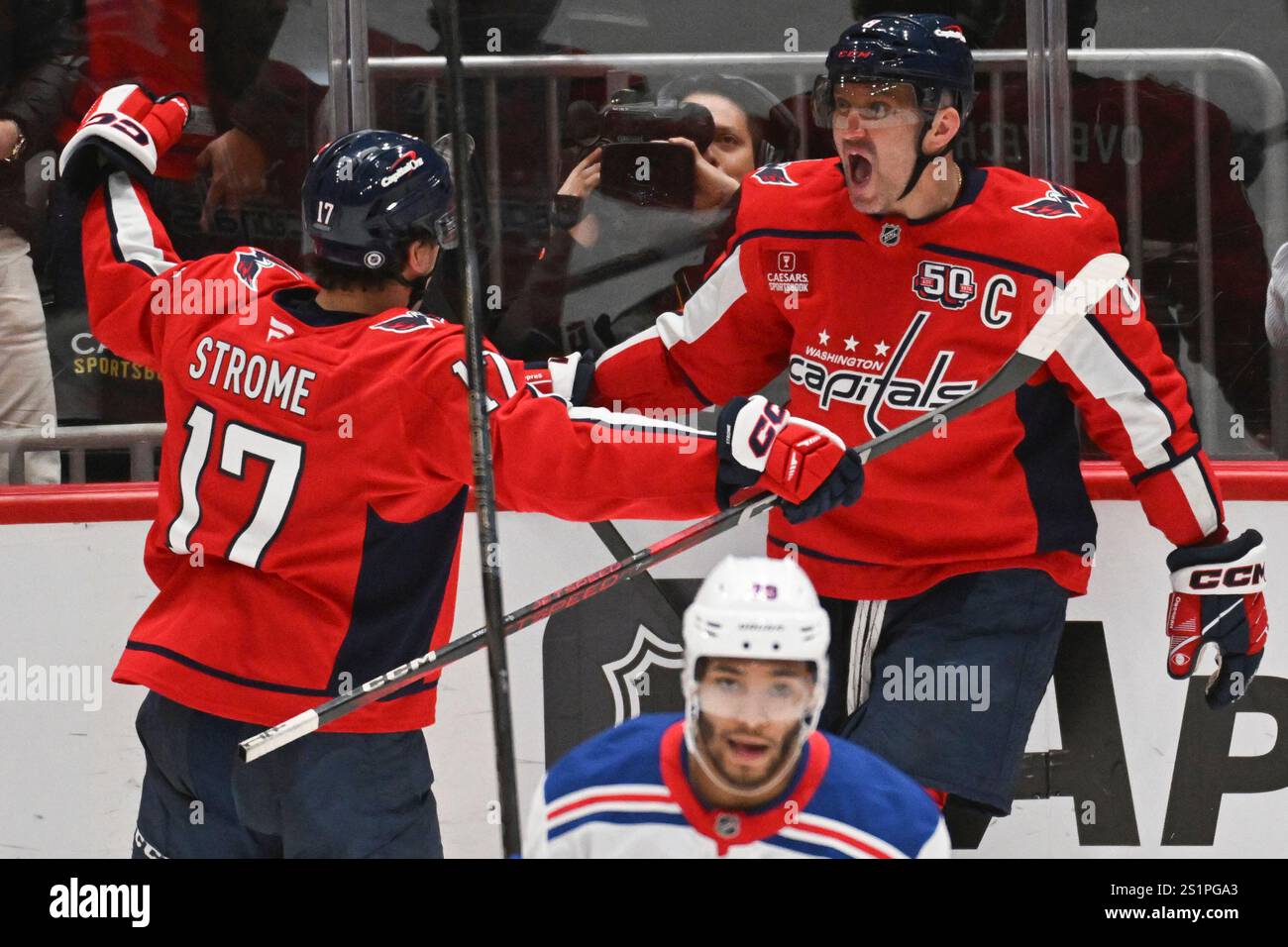 Washington Capitals center Dylan Strome (17) celebrates with left wing ...