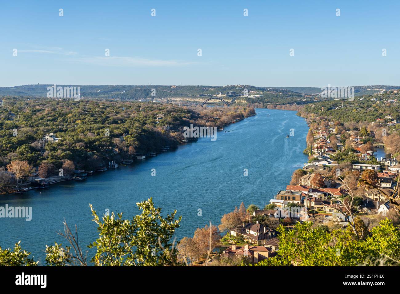 Expensive waterfront homes line the Colorado river near Austin Texas ...