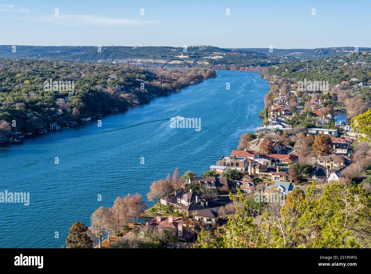 Expensive waterfront homes line the Colorado river near Austin Texas ...