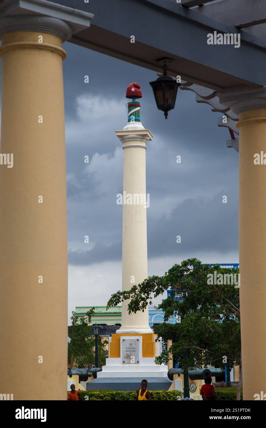 Framed by two doric columns, the 20 meters high column, crowned with a ...
