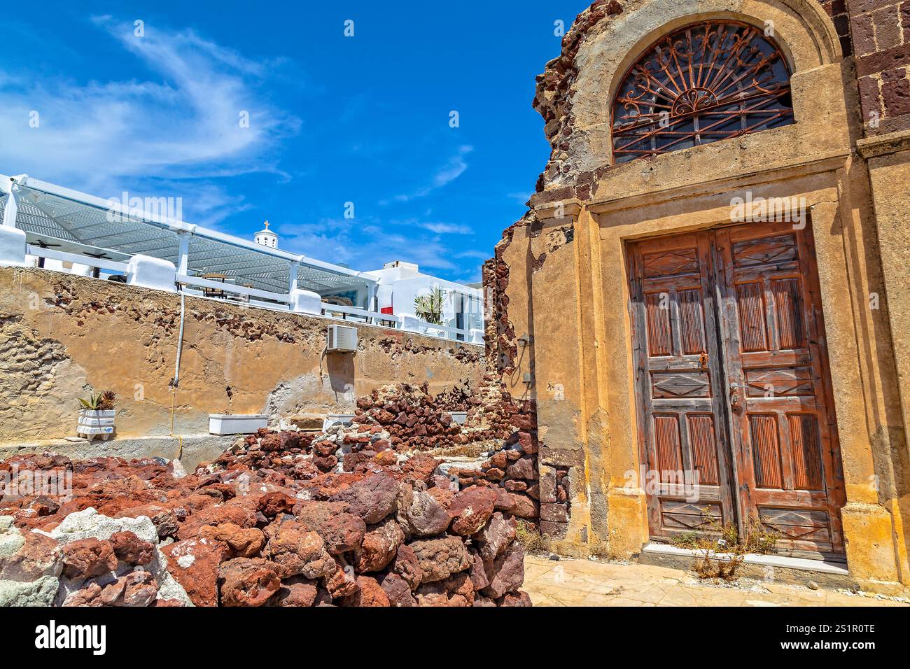 Restored Historic Building with Wooden Doors and Stone Walls Under a ...