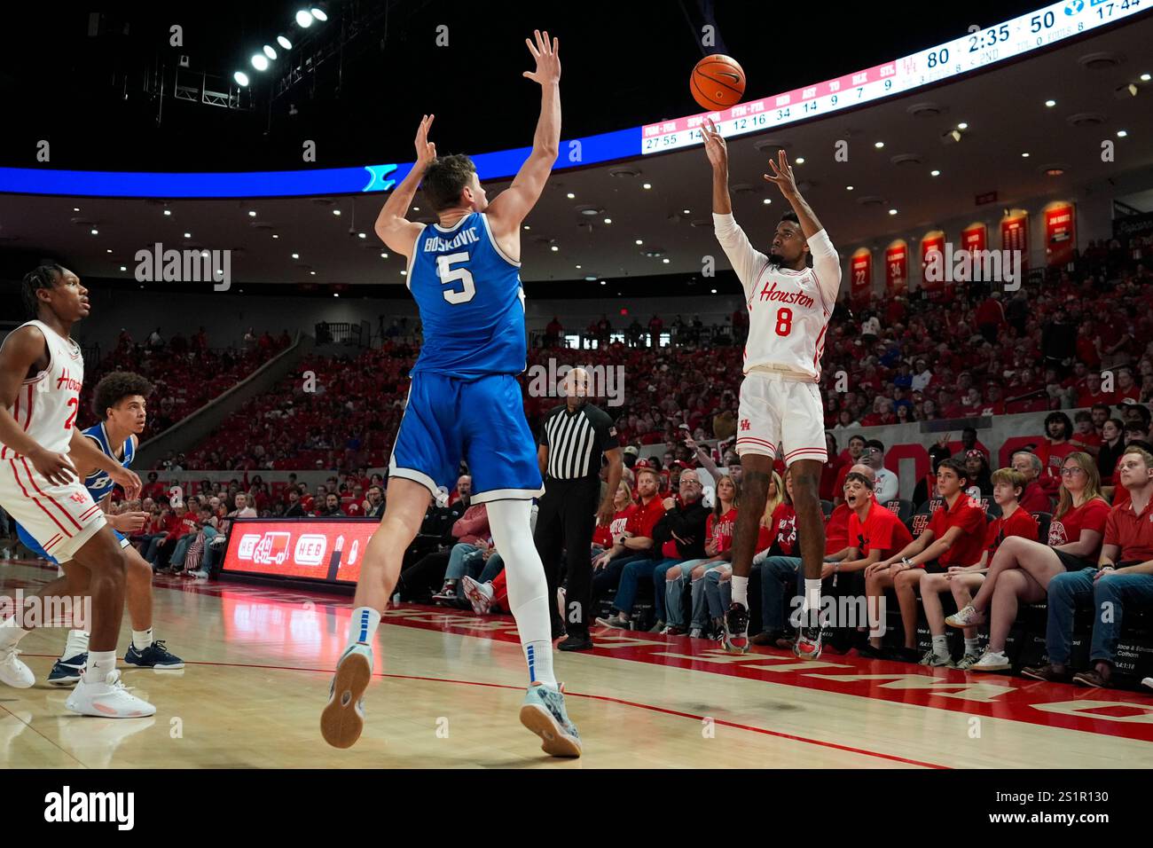 Houston guard Mylik Wilson (8) shoots a 3-pointer against BYU forward ...