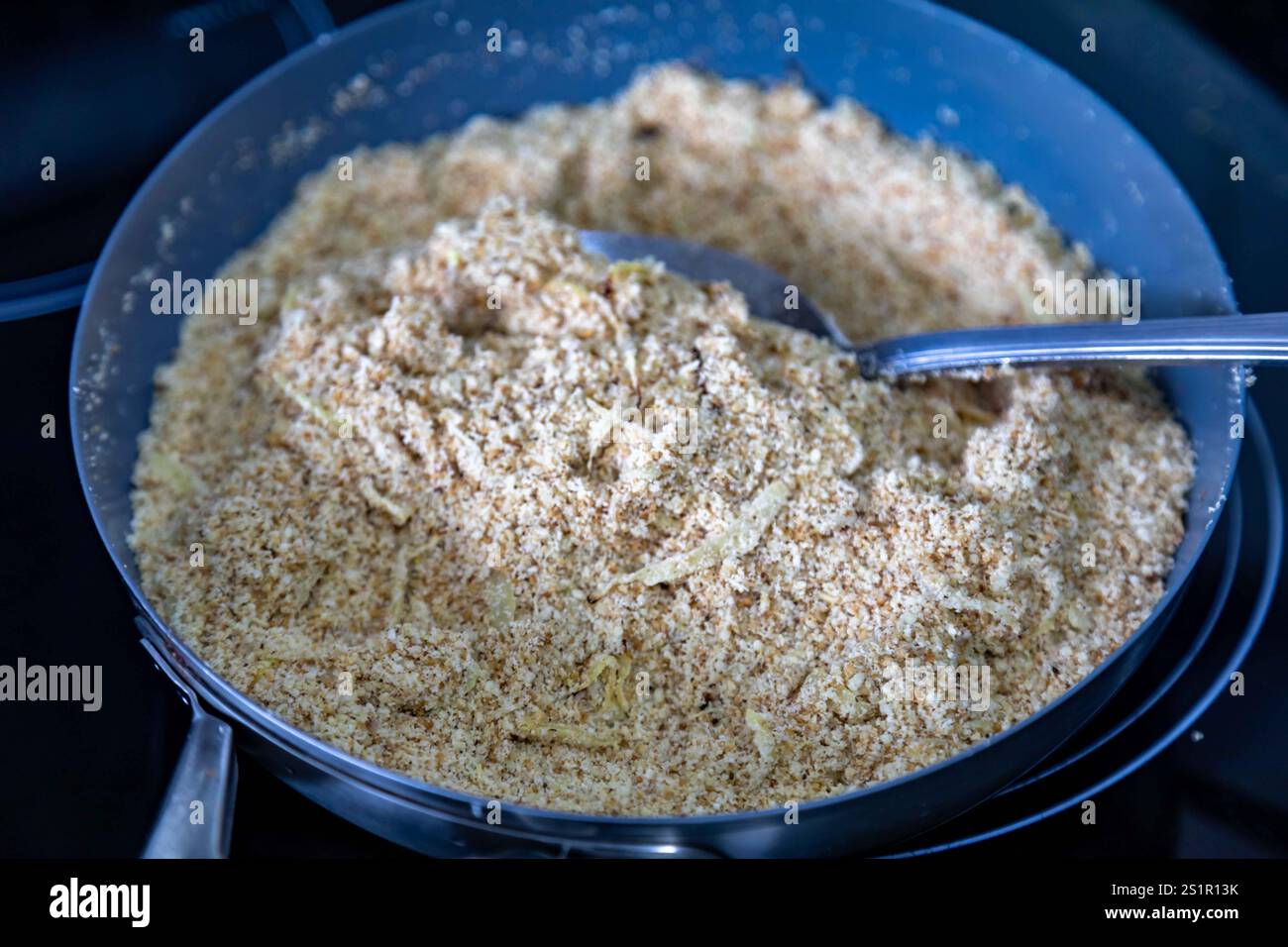 Traditional Brazilian farofa prepared with toasted cassava flour, bacon ...