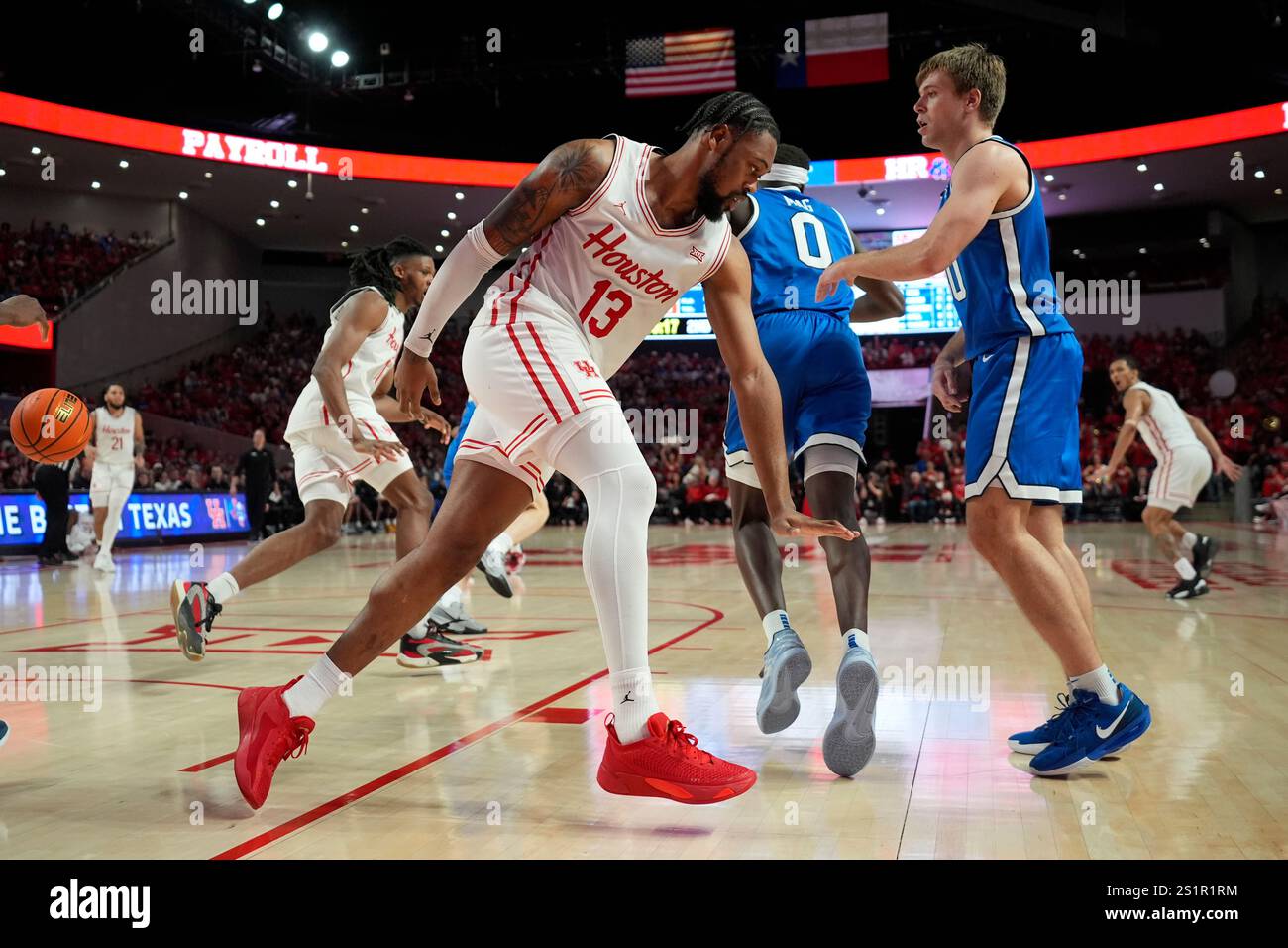 Houston forward J'Wan Roberts (13) reacts after making a shot during ...