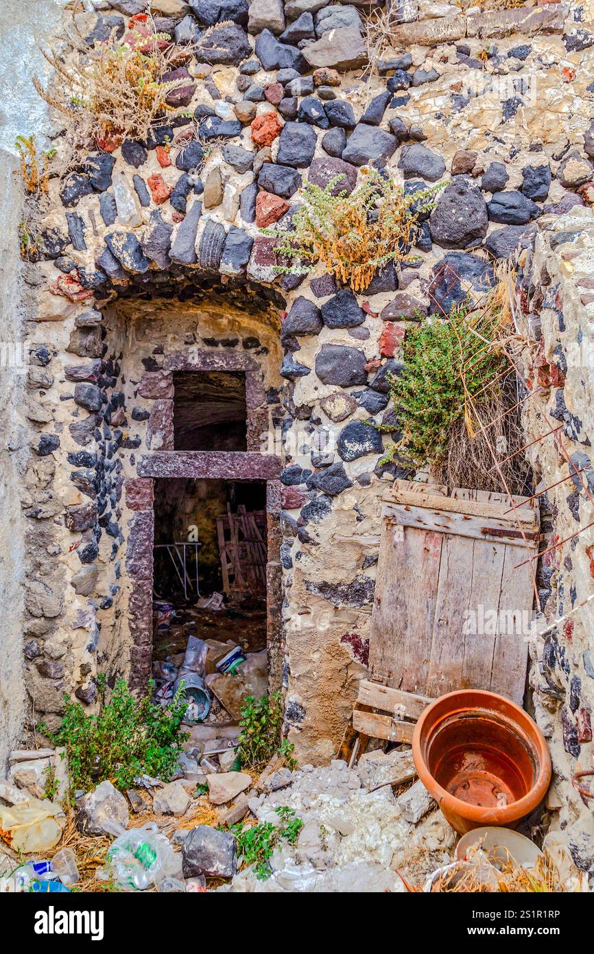 Aged Stone Structure With Entrance Overgrown by Plants in a Rustic ...