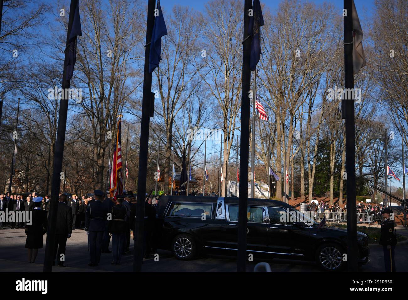 A hearse carrying the casket of former President Jimmy Carter arrives ...