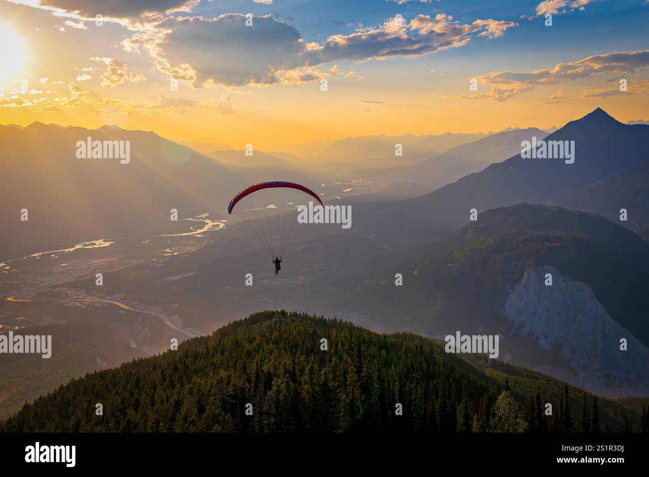 Paragliding at sunset at Mnt 7 in Golden BC Canada Stock Photo - Alamy