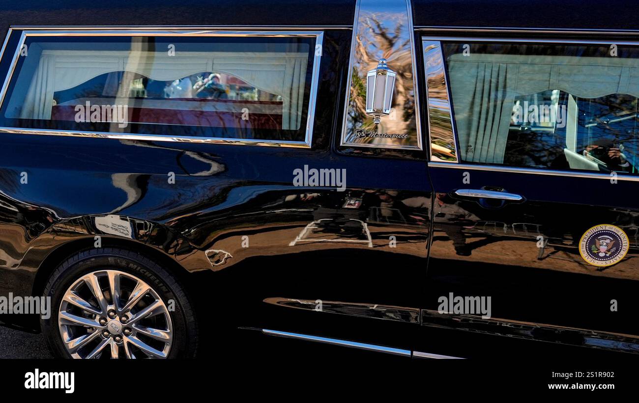 A funeral procession for former President Jimmy Carter moves through ...