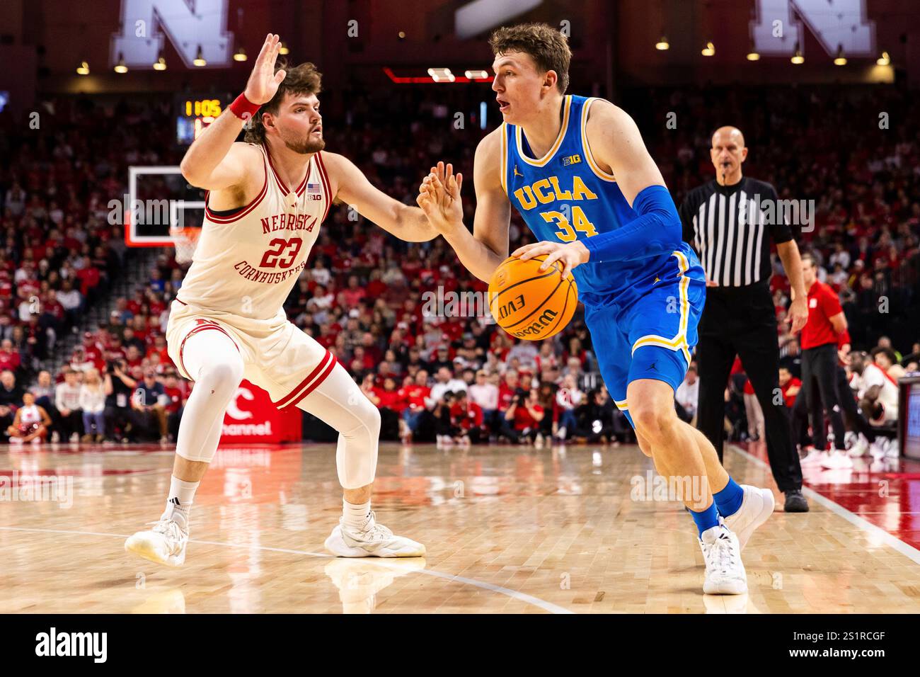 UCLA forward Tyler Bilodeau (34) drives against Nebraska forward Andrew ...