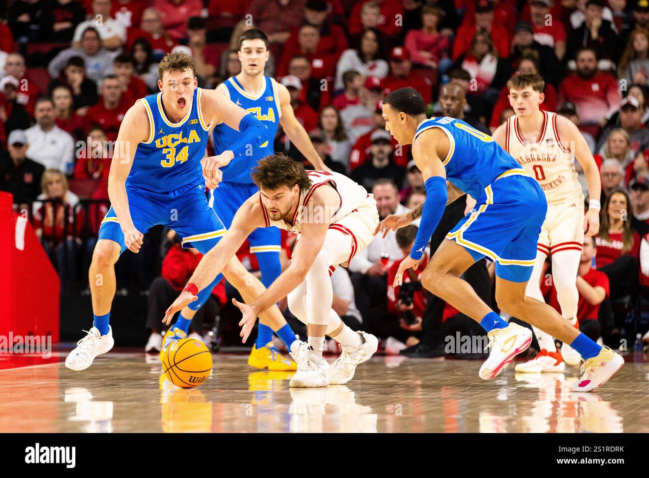 Nebraska forward Andrew Morgan, center, UCLA forward Tyler Bilodeau ...