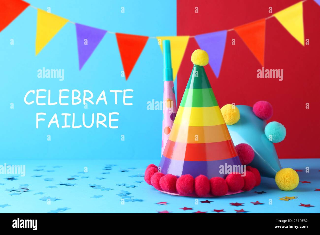 Celebrate failure. Party hats and blower on light blue background Stock ...