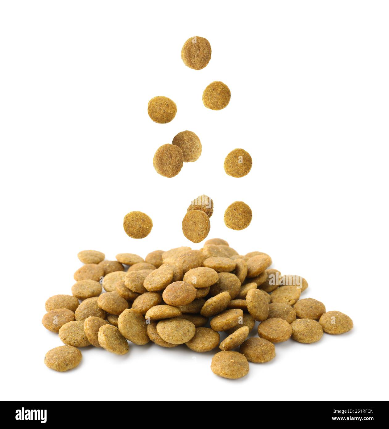 Dry pet food falling onto heap on white background Stock Photo - Alamy