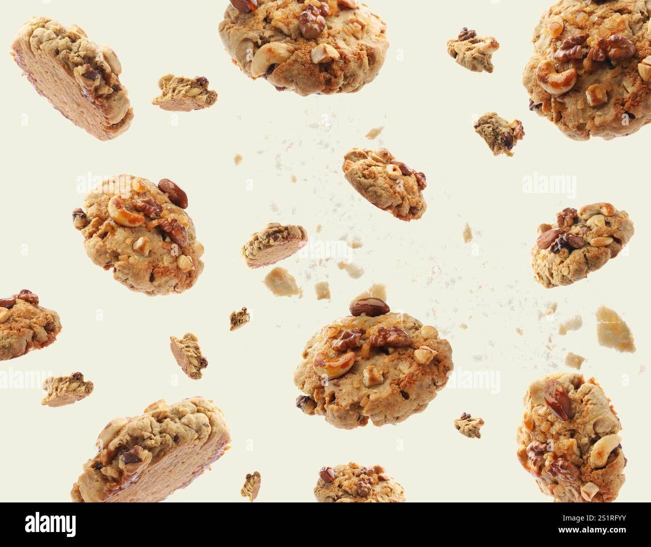 Yummy nut cookies in air on white background Stock Photo - Alamy