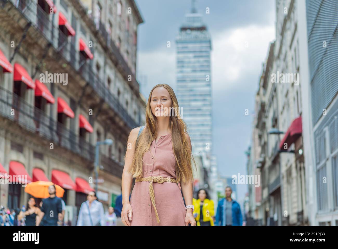 Female tourist exploring Latin American Tower in Mexico City. Iconic ...