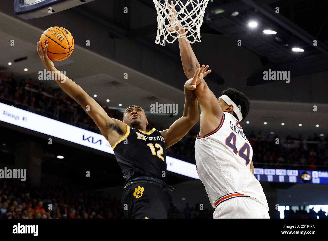 Missouri guard Tony Perkins (12) goes up to shoot as Auburn center ...