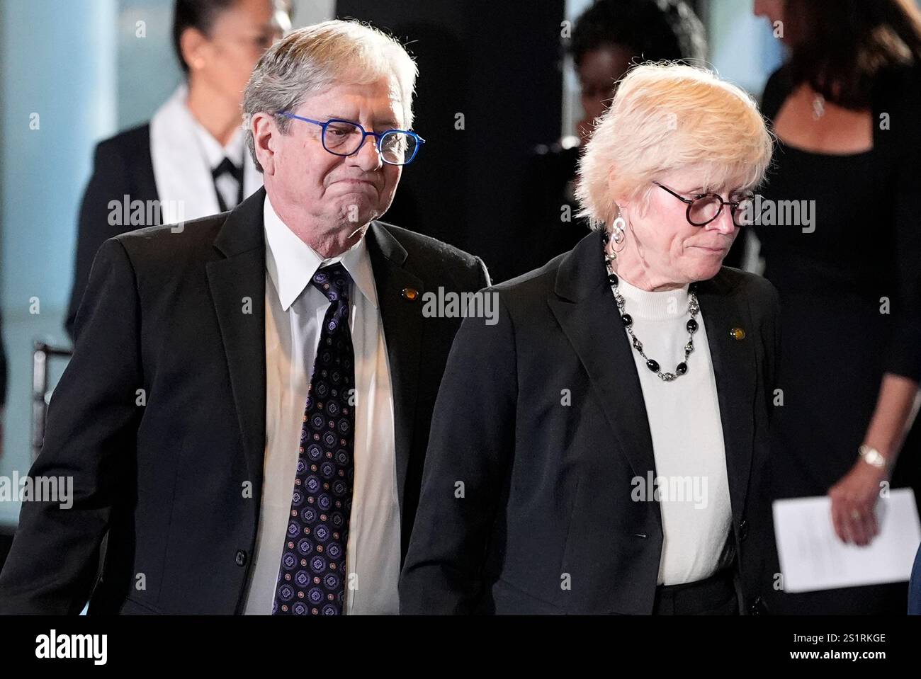 James "Chip" Carter and his wife Becky, depart after a service for ...