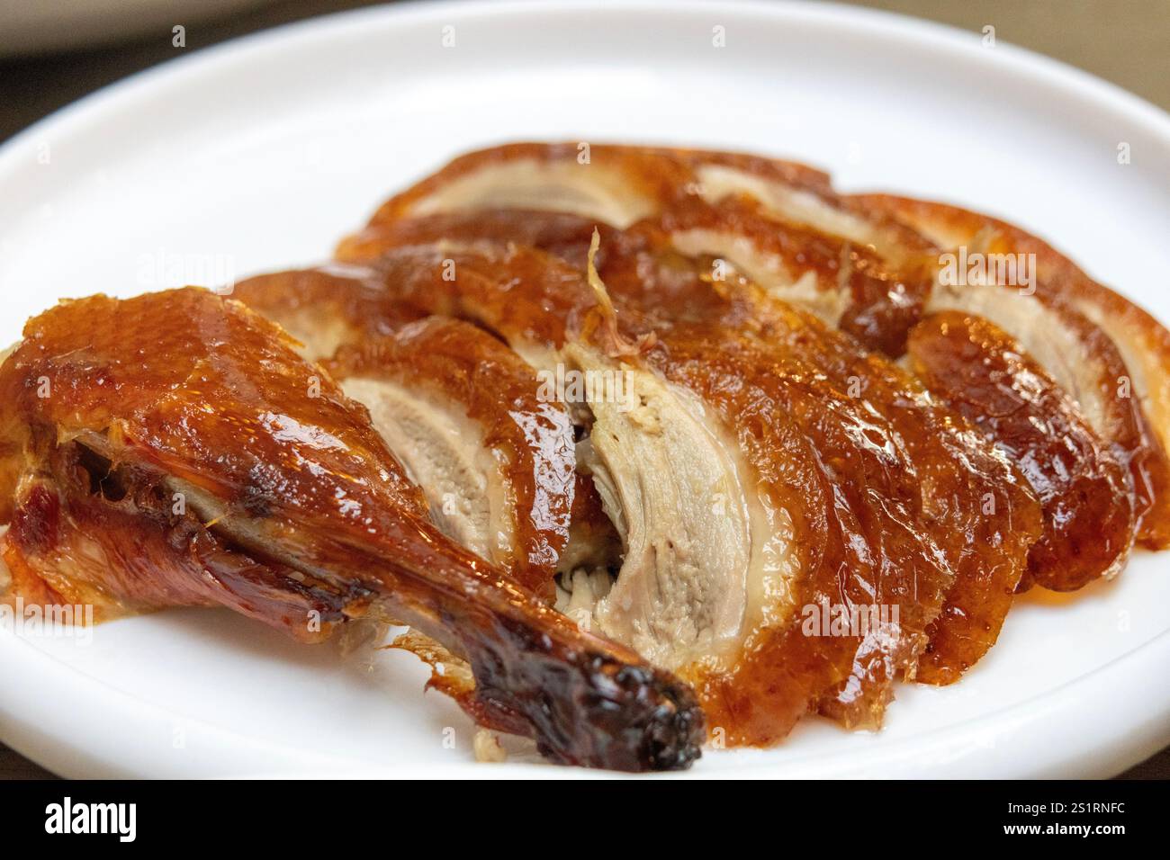 Chinese cook prepares Peking Roast Duck. Peking Duck is a famous duck ...