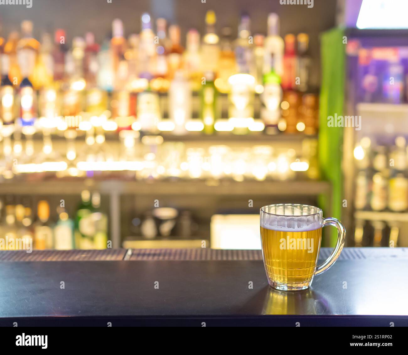 A mug of beer on the bar counter in a pub Stock Photo - Alamy