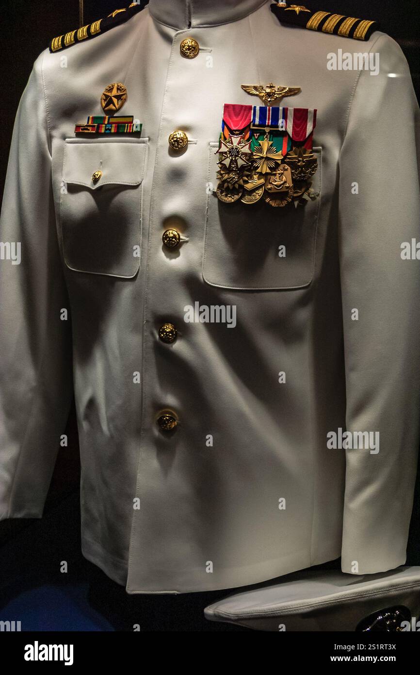 A military uniform with a star and a cross on the left side and a gold ...