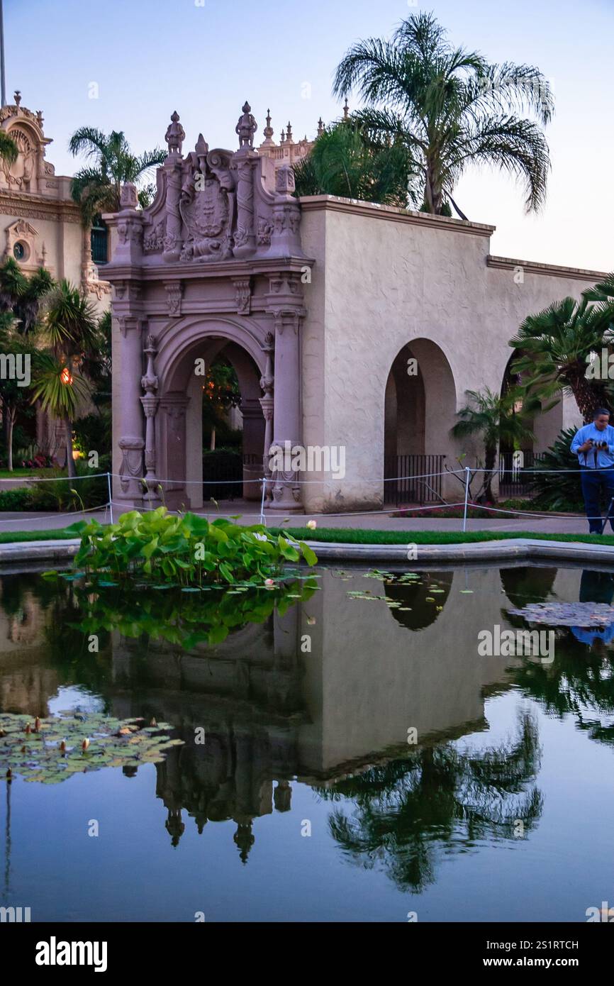 A large building with a fountain in front of it. The fountain is ...
