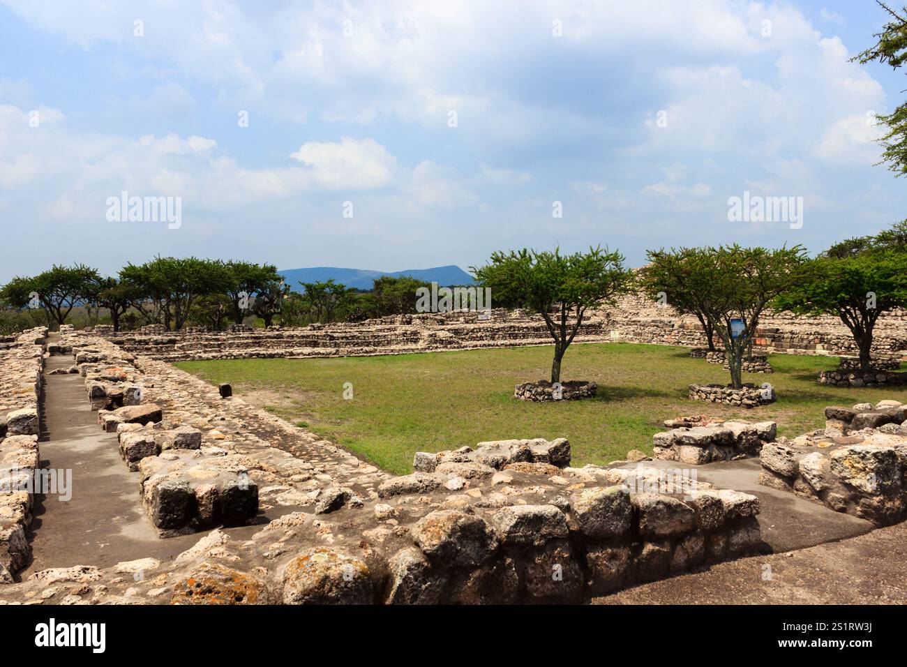 Ancient Stone Ruins with Grass Fields and Trees Under a Blue Sky ...