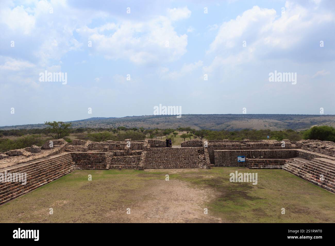 Ancient Stone Ruins Surrounded by Rolling Hills Under a Clear Sky ...