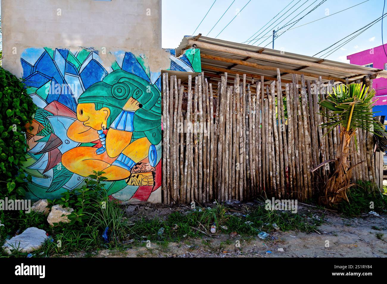 Vibrant Street Art Depicting Cultural Themes Adjacent to a Rustic ...