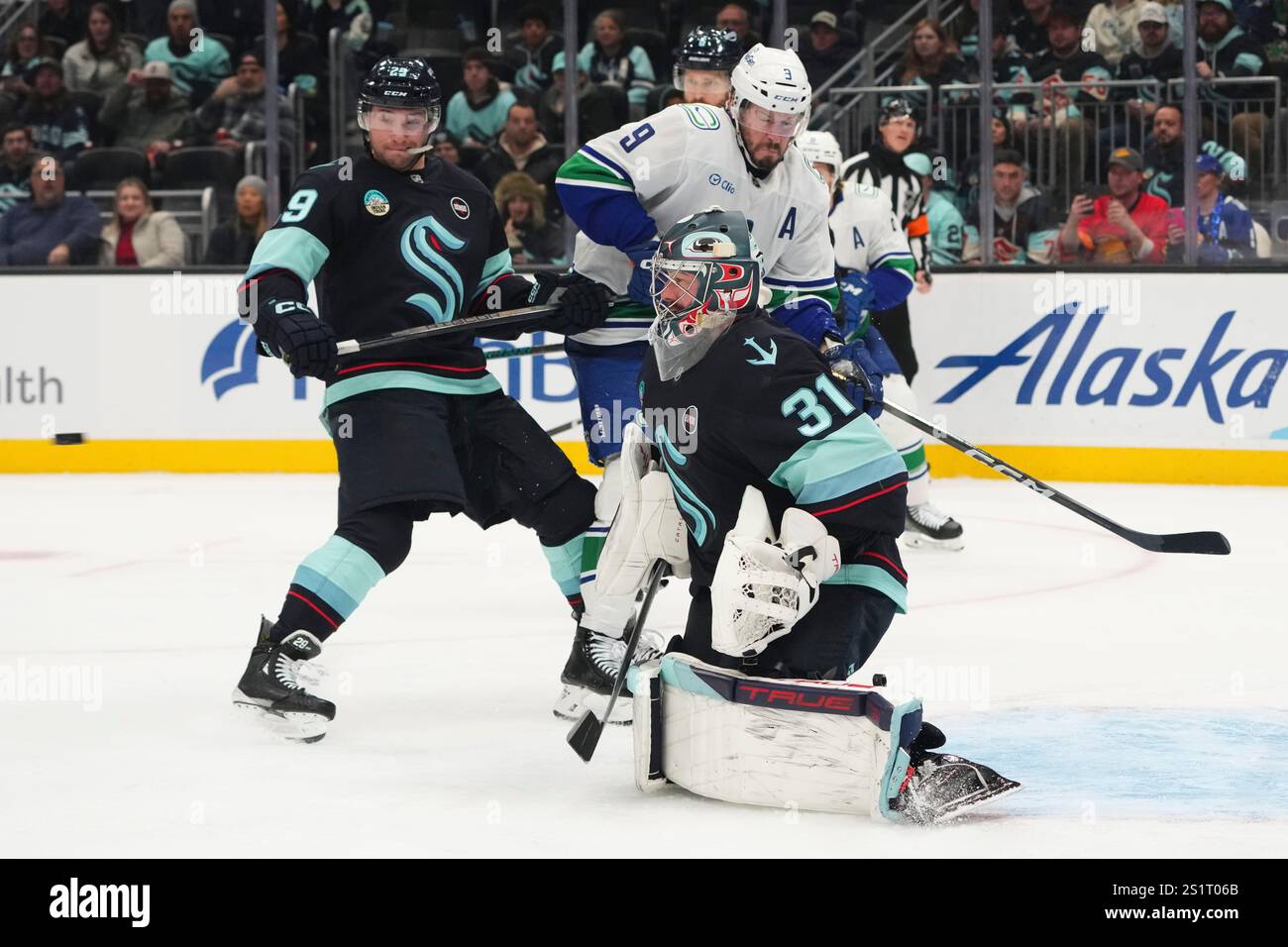 Seattle Kraken defenseman Vince Dunn, left and goaltender Philipp ...
