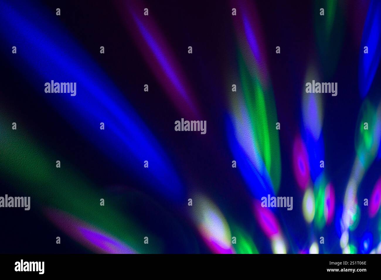 Colorful light beams generated by moving party lighthead Stock Photo ...