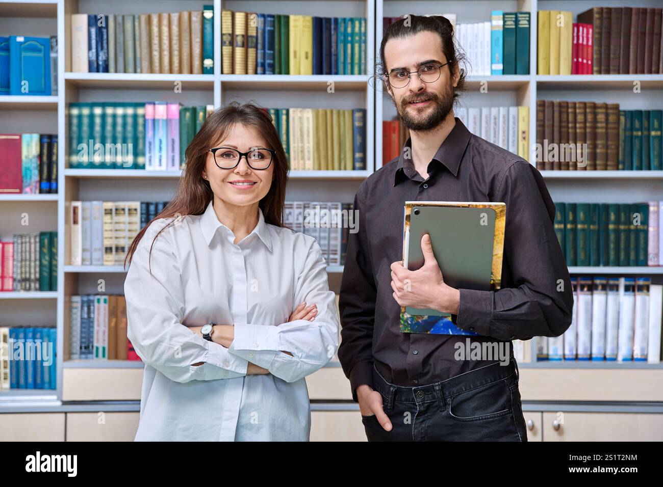 Portrait of man and woman colleagues educators teachers inside ...