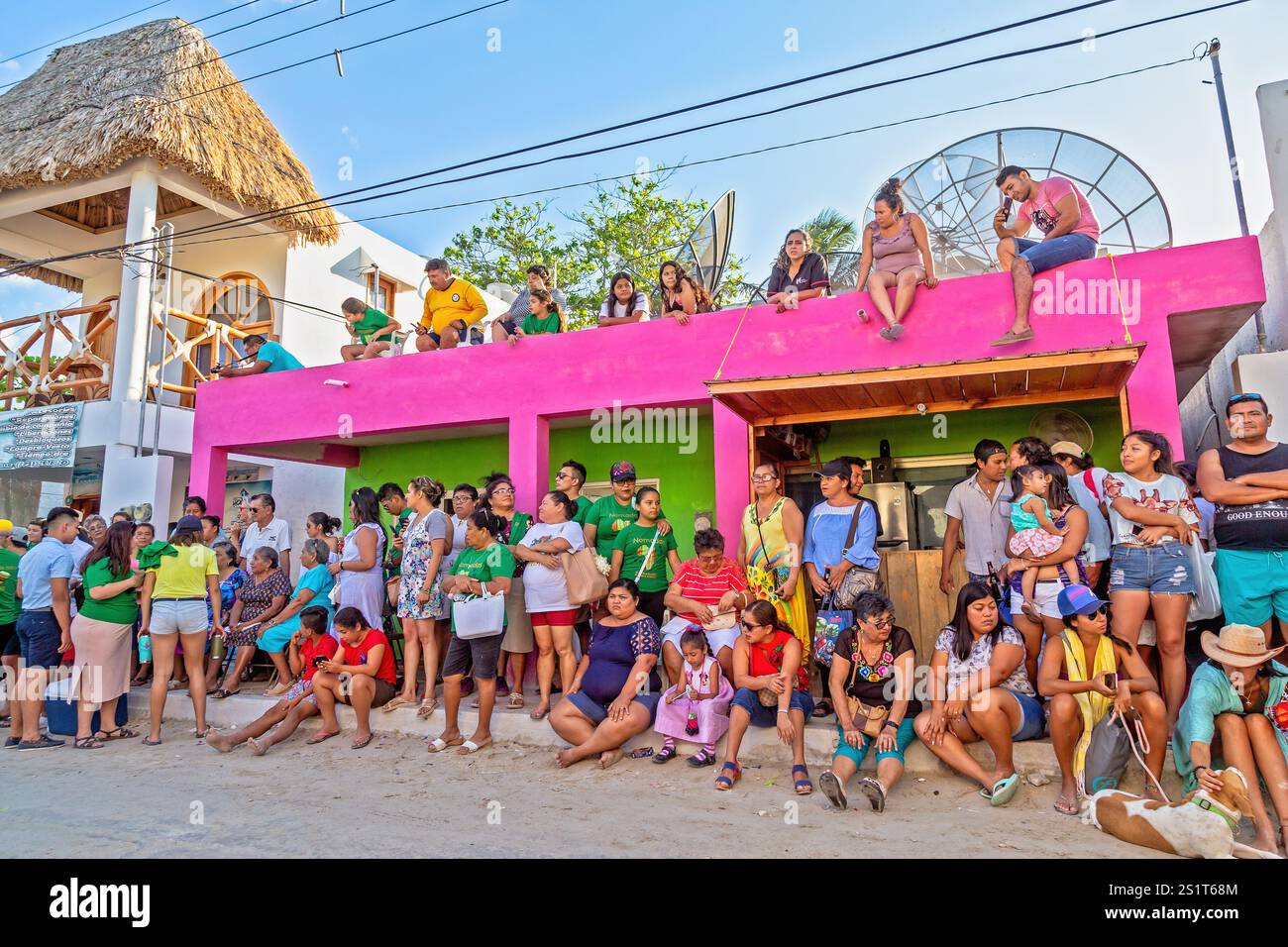 Local Parade Celebration with Gathered Crowd in Small Village Street ...