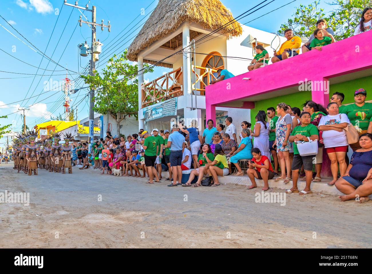 Local Parade Celebration with Gathered Crowd in Small Village Street ...