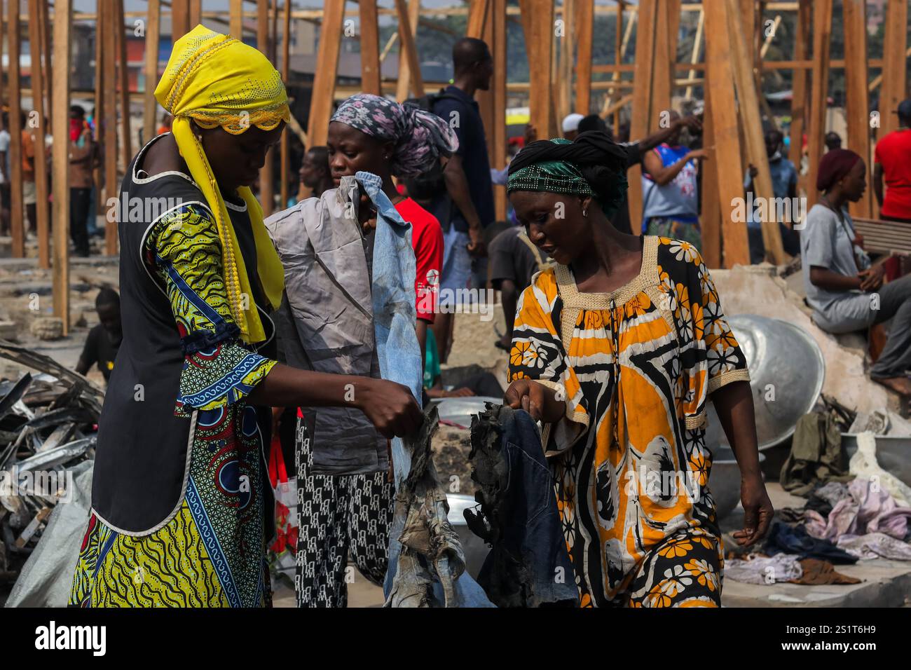 Accra, Accra, Ghana. 4th Jan, 2025. Women holds burnt cloths during the ...
