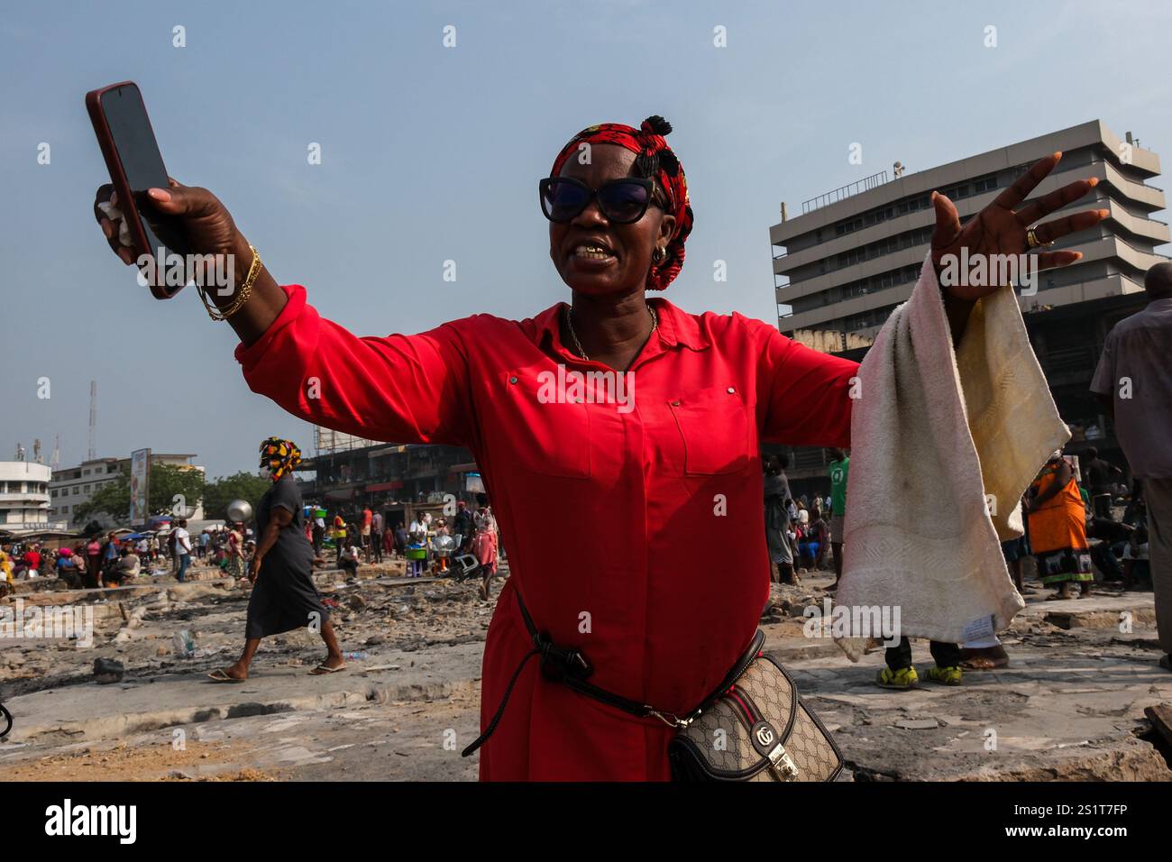 Accra, Accra, Ghana. 4th Jan, 2025. A trader speak during the ...