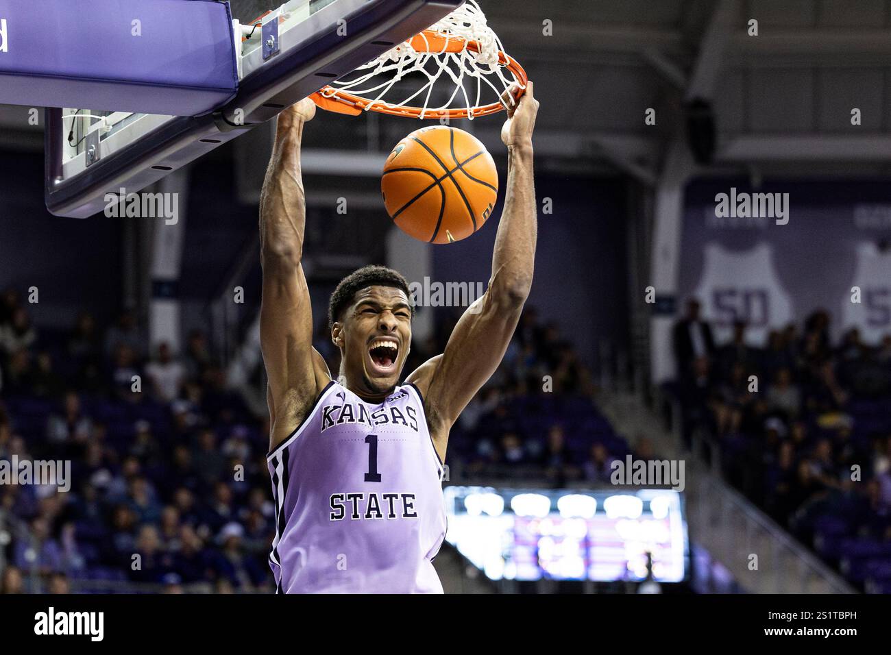 Kansas State forward David N'Guessan (1) catches an alley oop for a ...