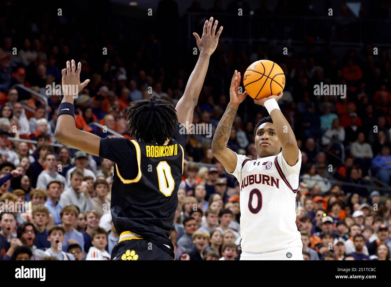 Auburn guard Tahaad Pettiford, right, prepares to shoot a 3-point ...