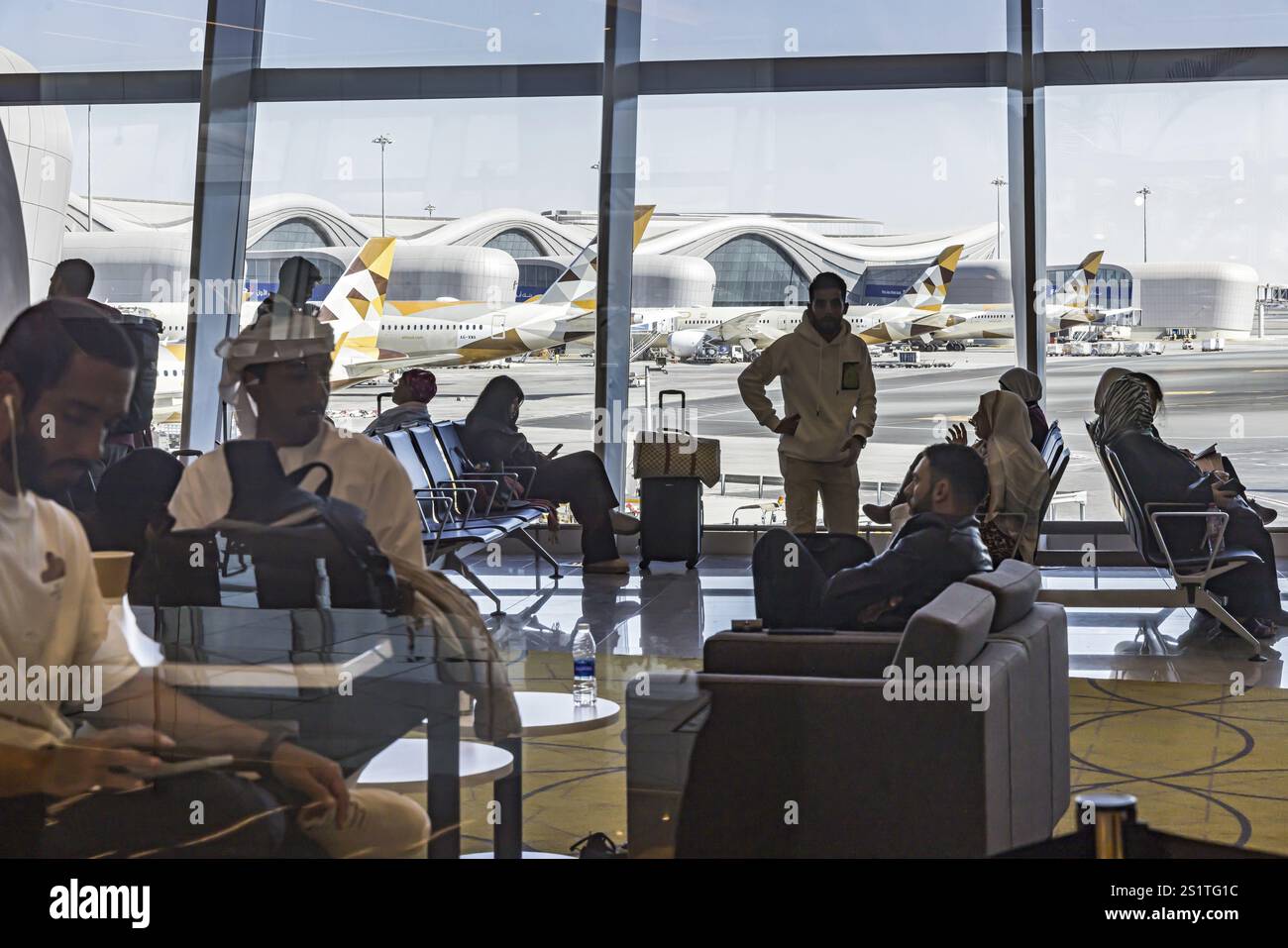 Abu Dhabi Airport. View of the modern terminal with Etihad airline ...
