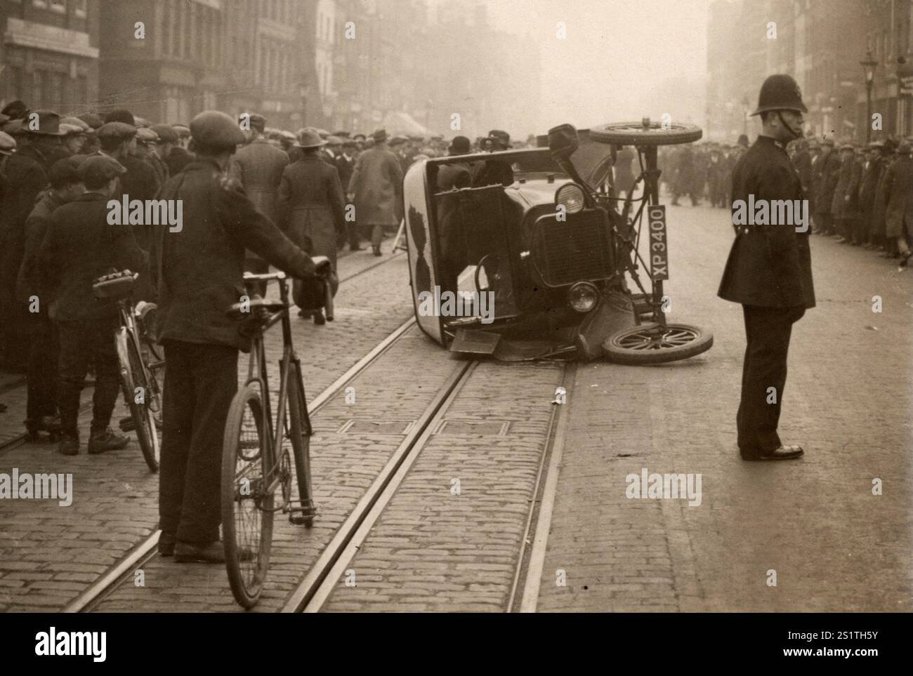 General strike in England 1926. In the middle of the street lies an ...