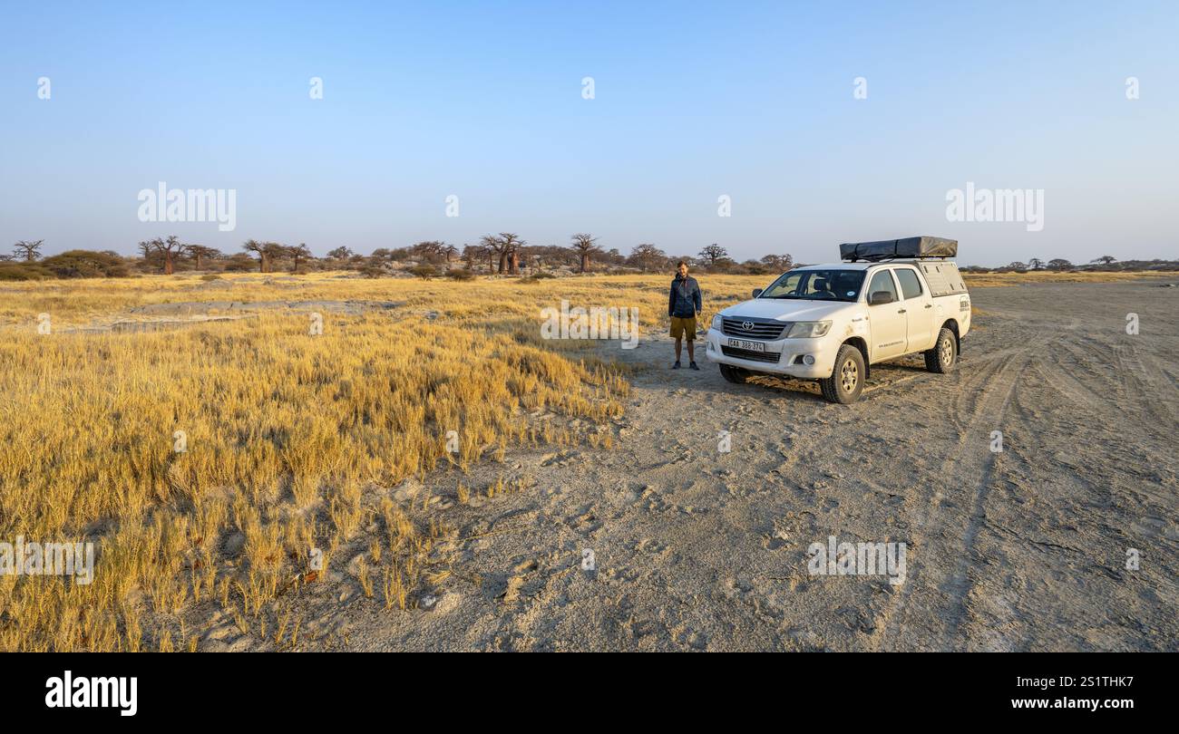 Tourist with off-road vehicle on a salt pan, Kubu Island (Lekubu) at ...