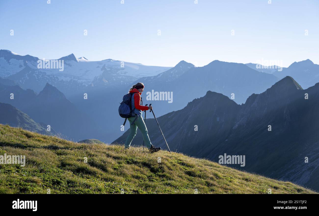 Hiker enjoying the mountain panorama in the morning, Venediger group ...