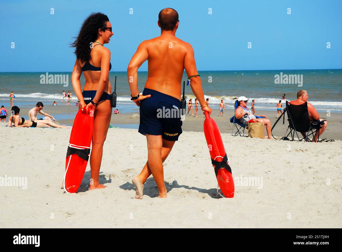 A female and male lifeguard stand at the ready on the Grand Strand of ...