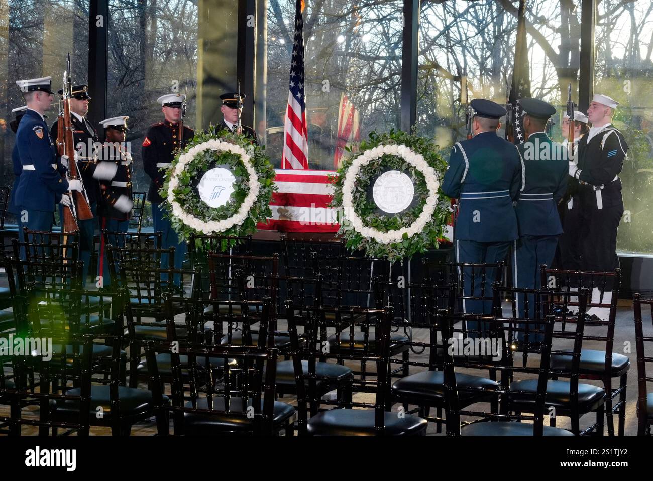 The Guard of Honor stands at the flag-draped casket of former President Jimmy Carter as he lies ...