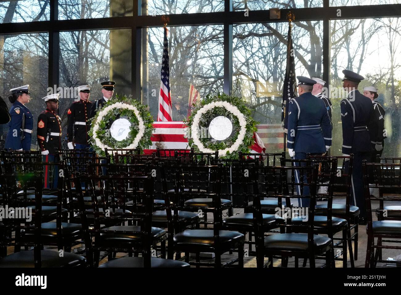 The Guard of Honor stands at the flag-draped casket of former President Jimmy Carter as he lies ...